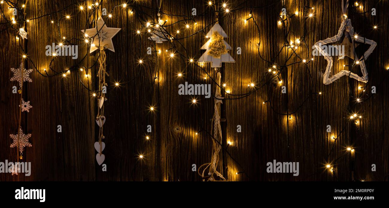 christmas lights and decorations on wooden background Stock Photo - Alamy