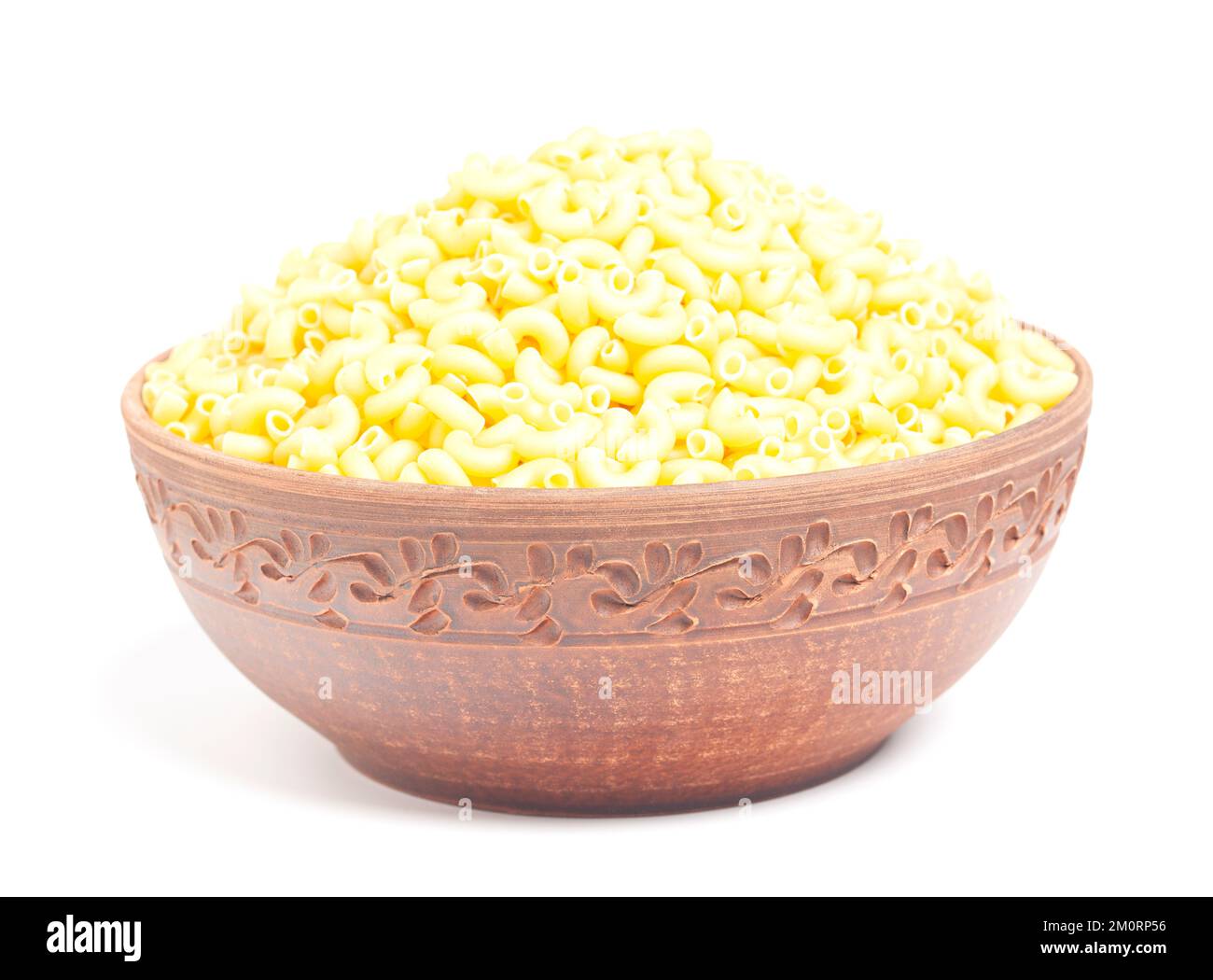 Italian pasta in brown clay bowl isolated on white background Stock ...