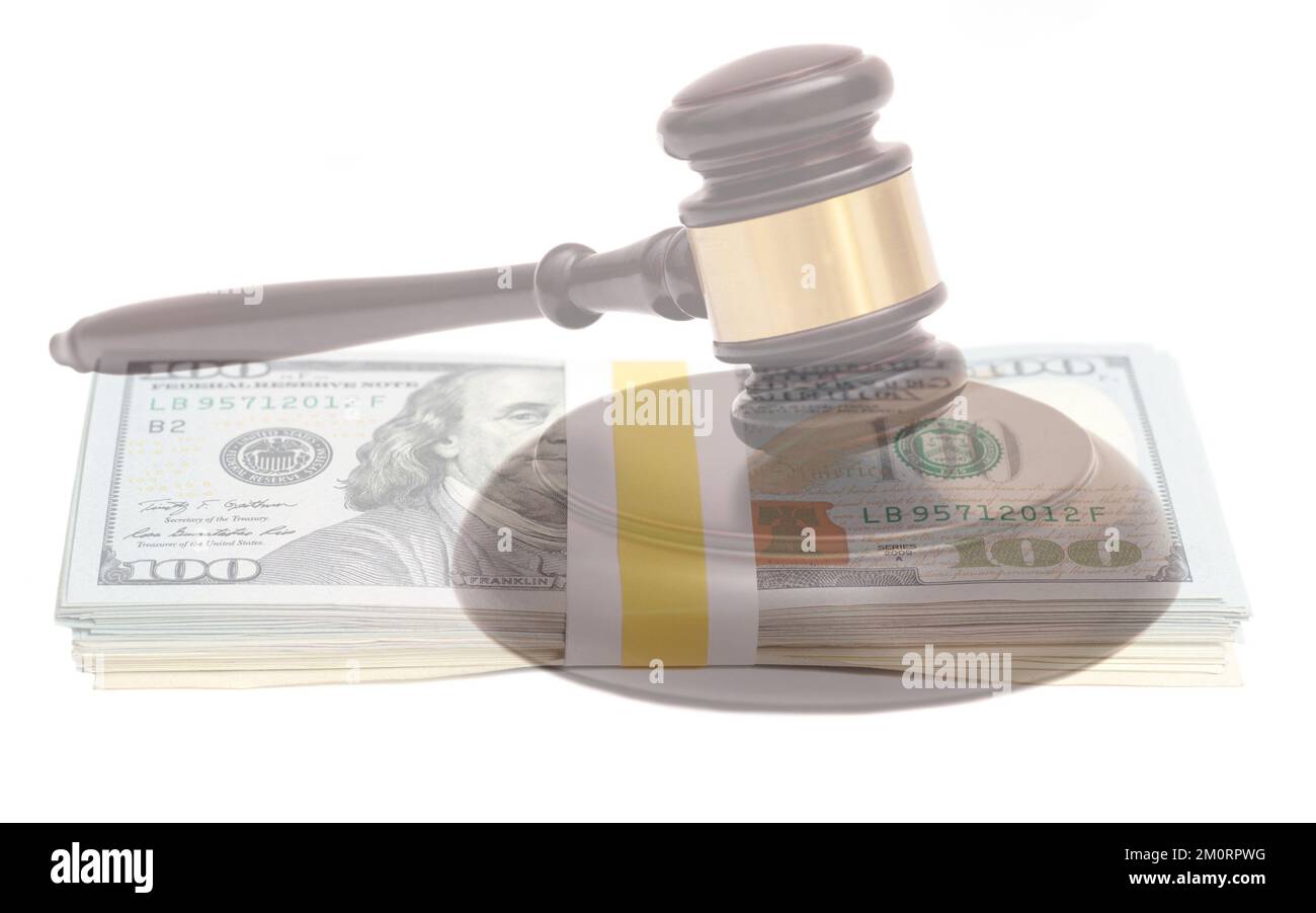 Wooden judge gavel on a stack of hundred-dollar bills Stock Photo - Alamy