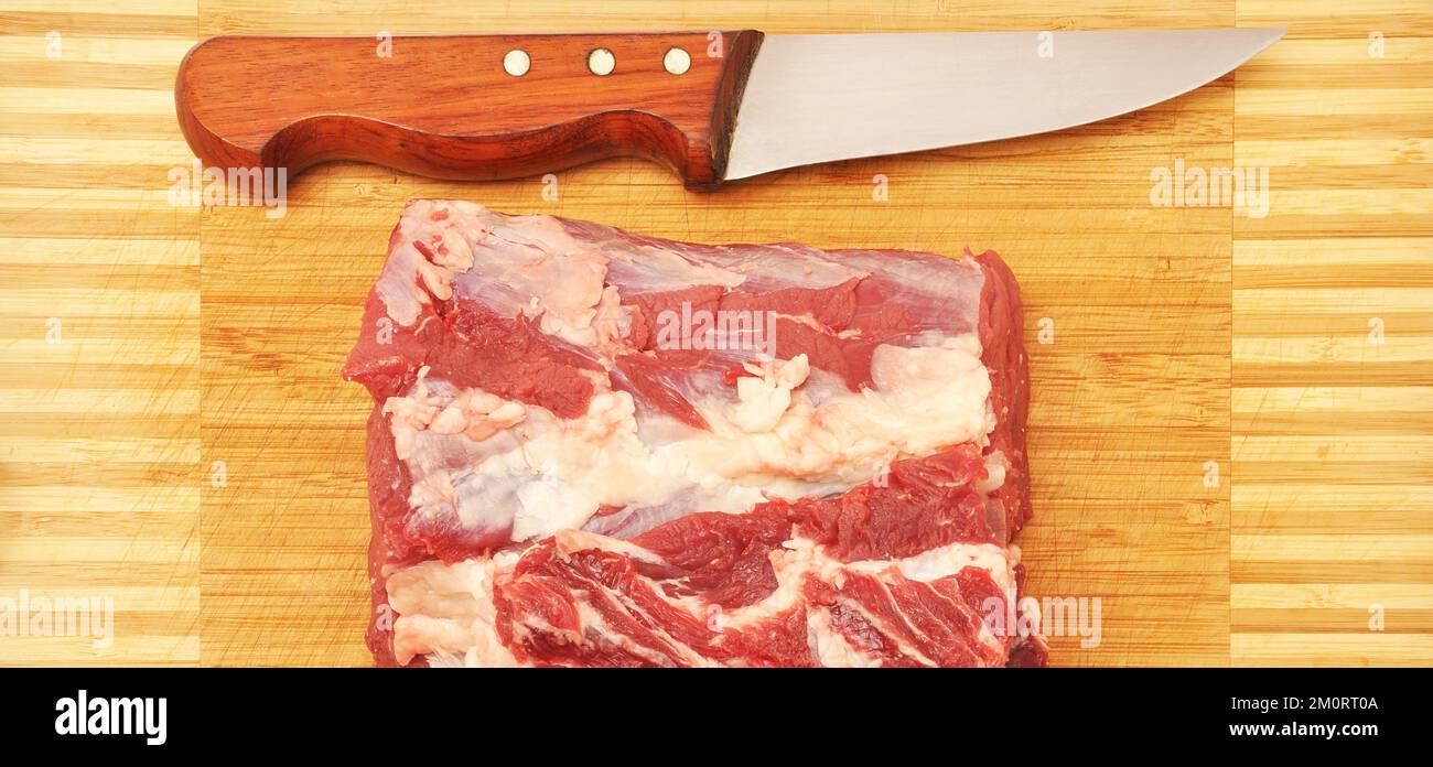 Clean very fresh red raw cow meat beef and knife, bamboo on cutting ...