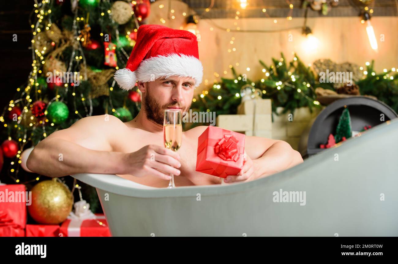 Winter holidays. Christmas concept. Man lying in bathtub relax with ...