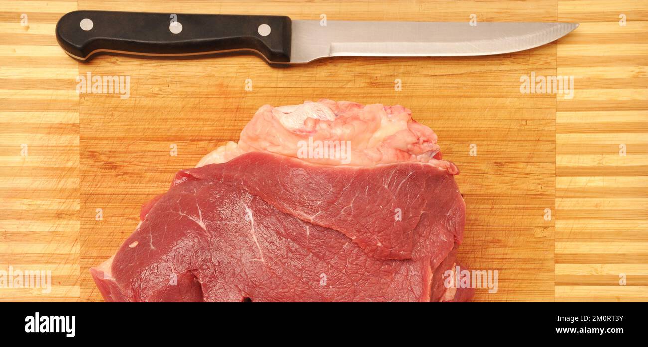 Clean very fresh red raw cow meat beef and knife, bamboo on cutting ...
