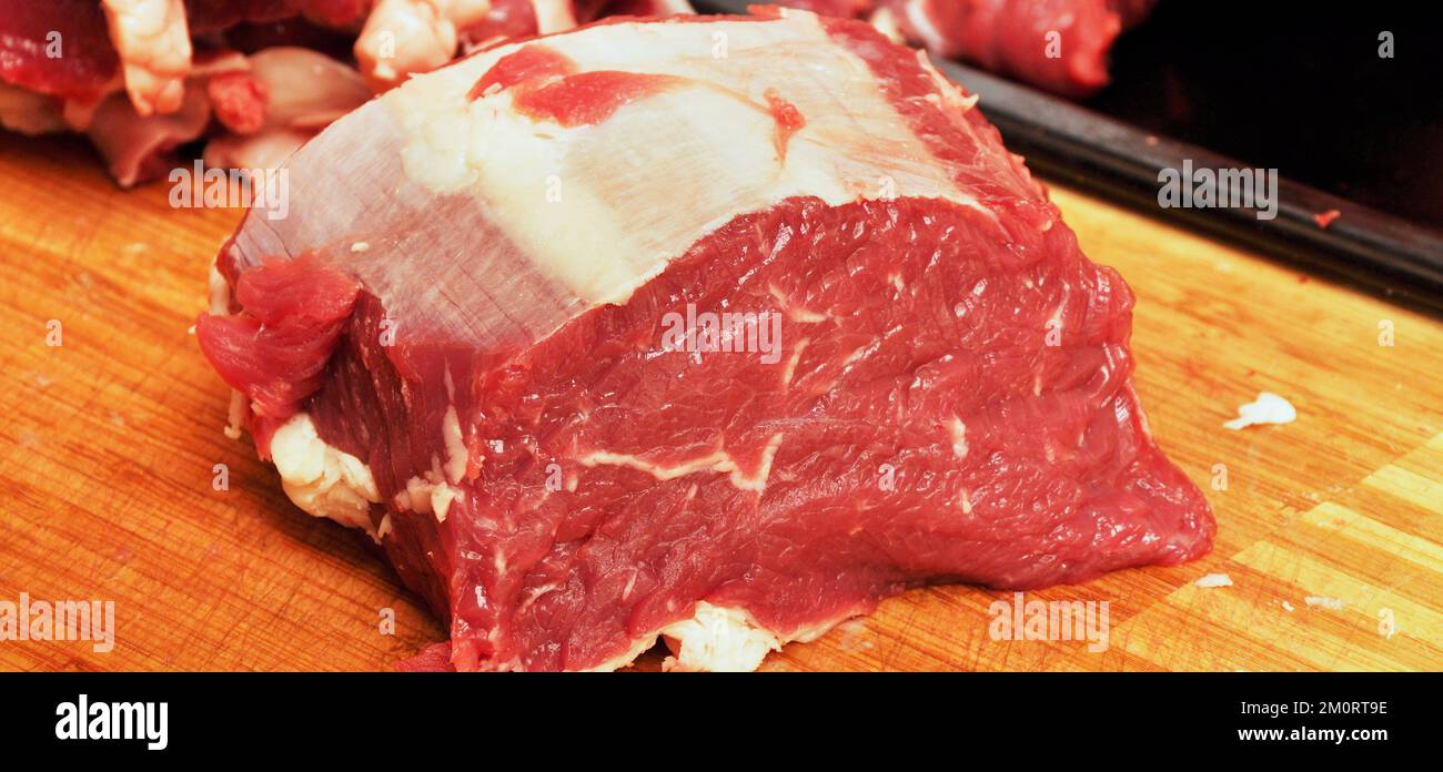 Clean very fresh red raw cow meat beef, bamboo on cutting board, cow ...