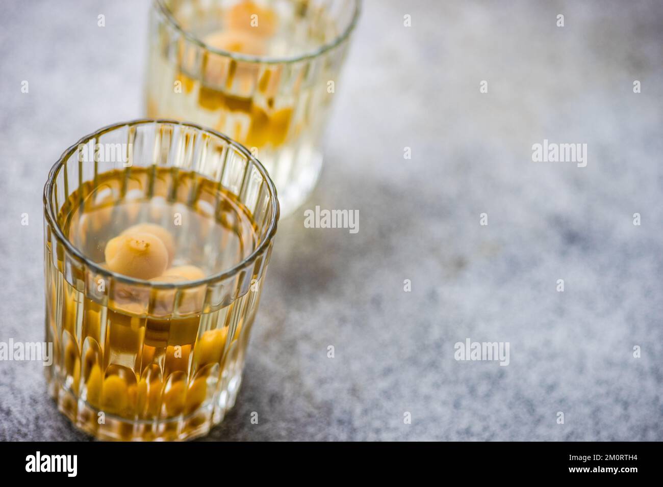 Close-up of two vodka cocktails with cherries Stock Photo - Alamy