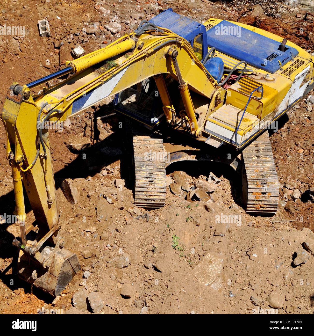 Excavator continues to work at the construction site, excavation site ...
