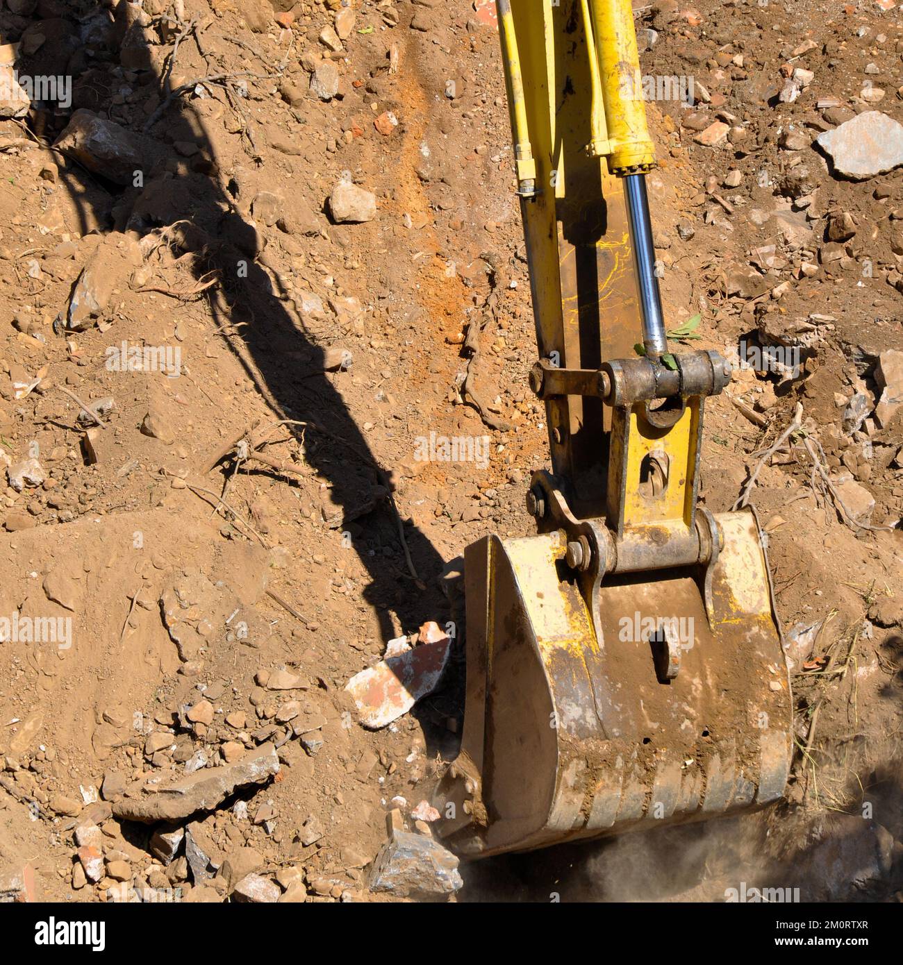 Excavator continues to work at the construction site, excavation site ...