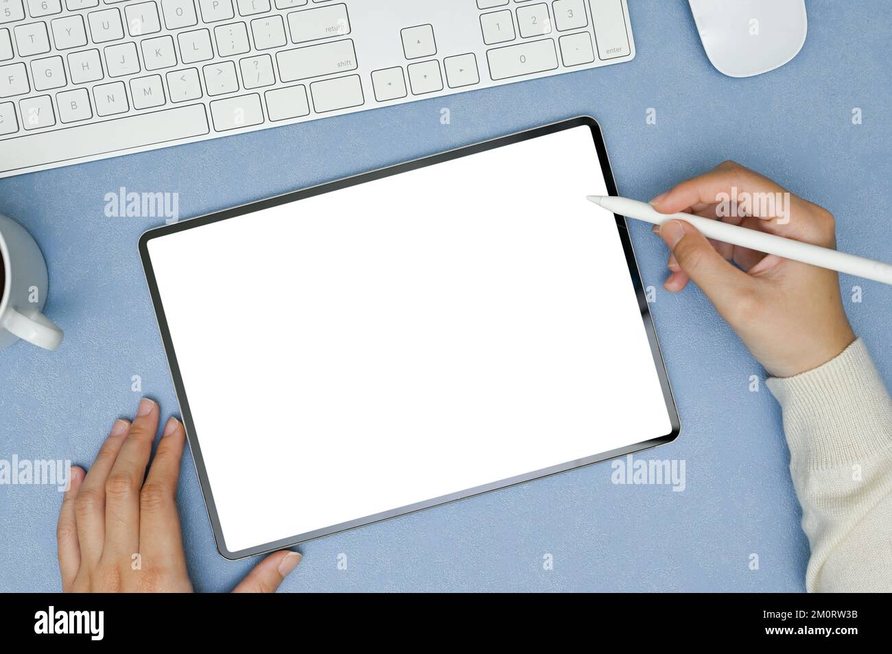 Overhead shot, A female using digital tablet touchpad, designing her ...