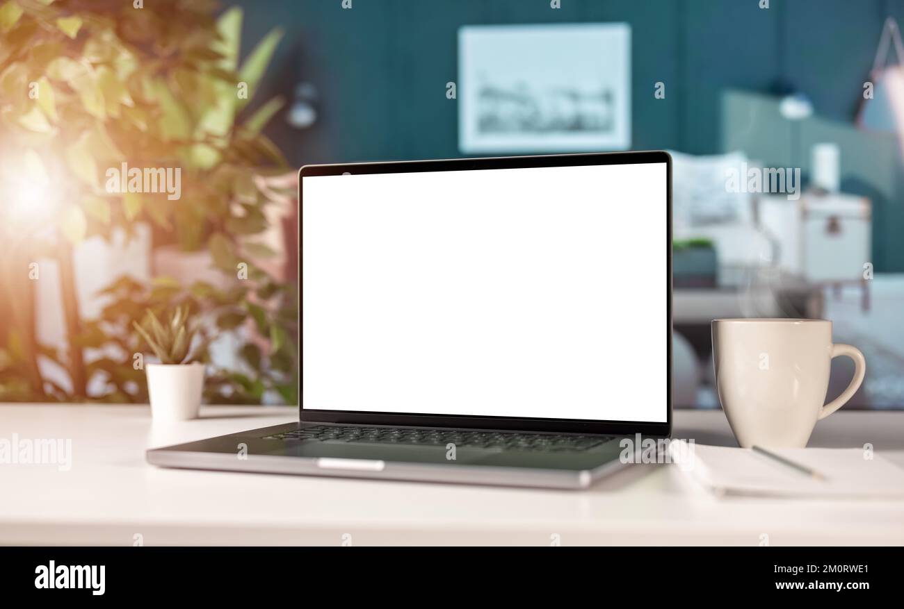 Blank screen laptop on desk Stock Photo - Alamy