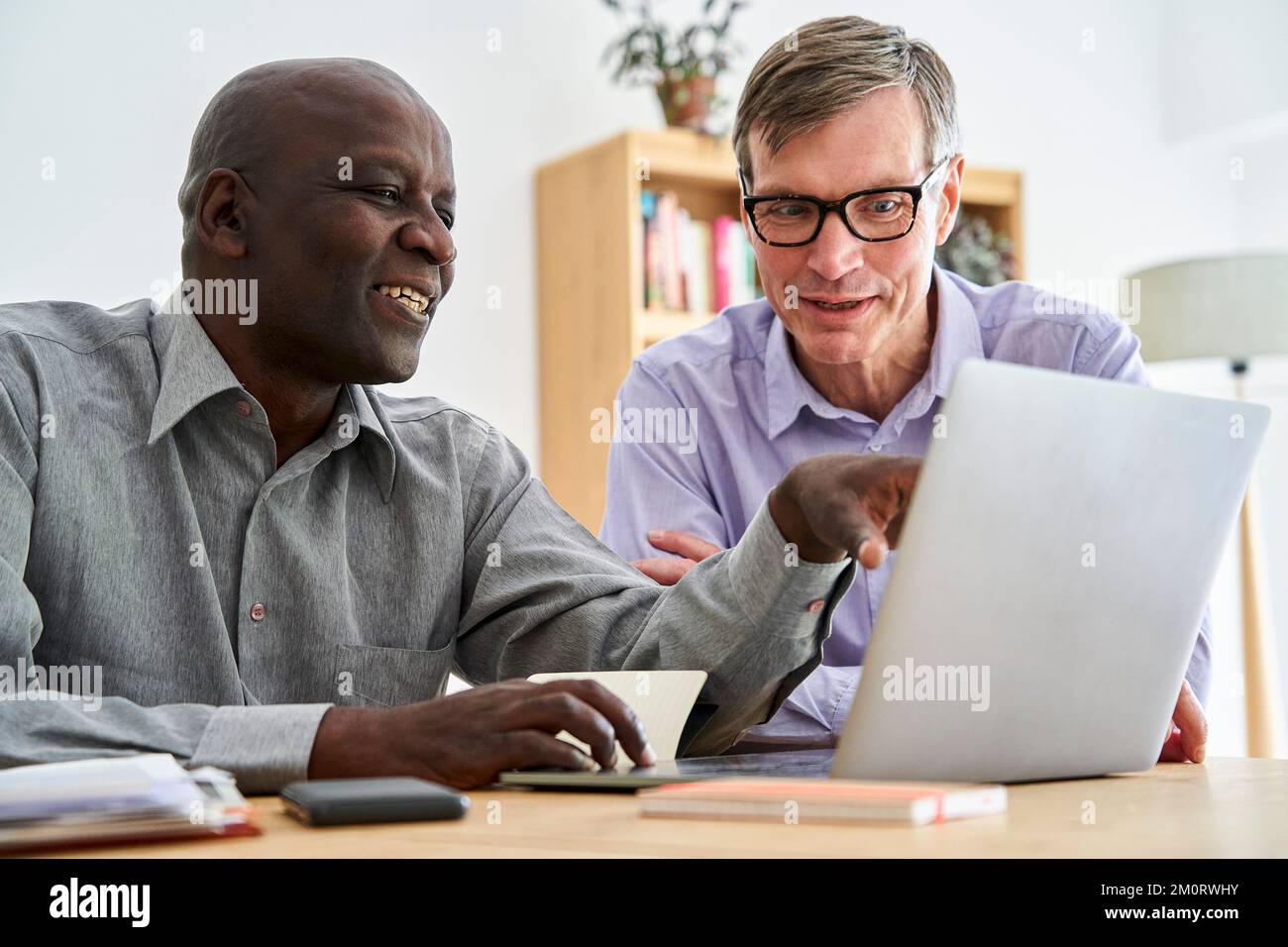 Two multiracial male office hi-res stock photography and images - Alamy