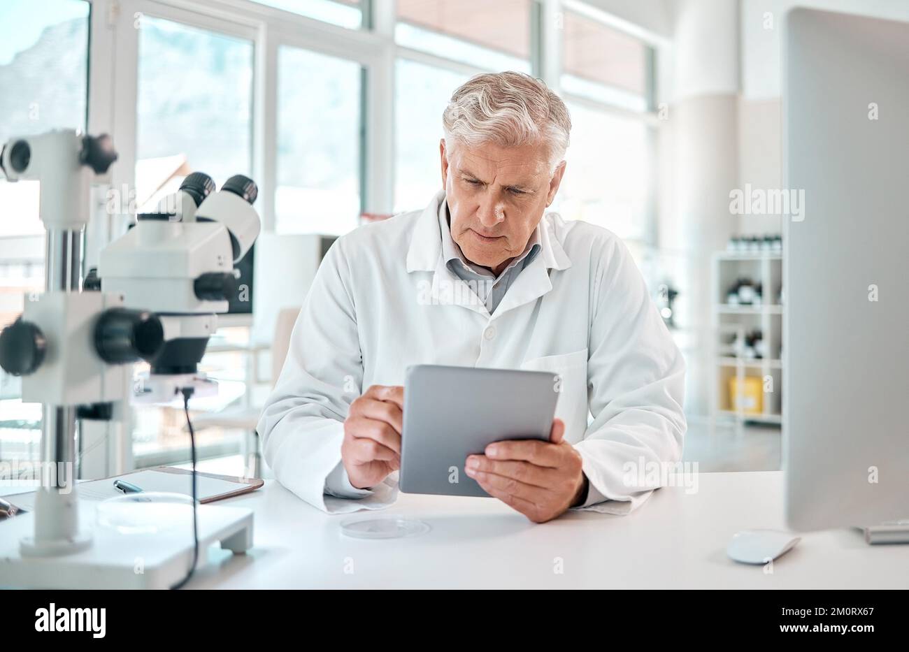 Unravelling the world of science. a senior scientist using a digital ...