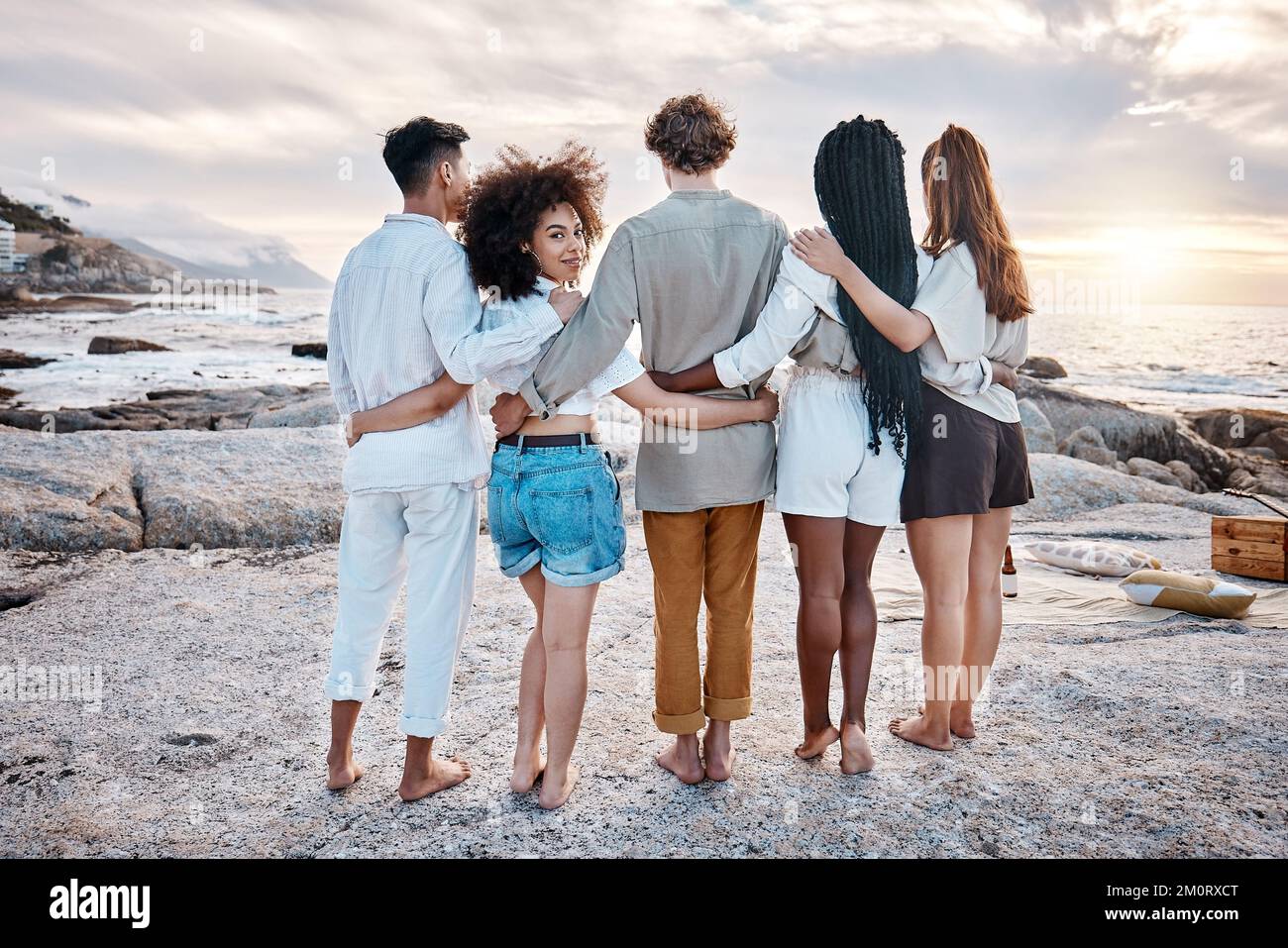 Rear view of a Unknown group of friends enjoying their time together at ...