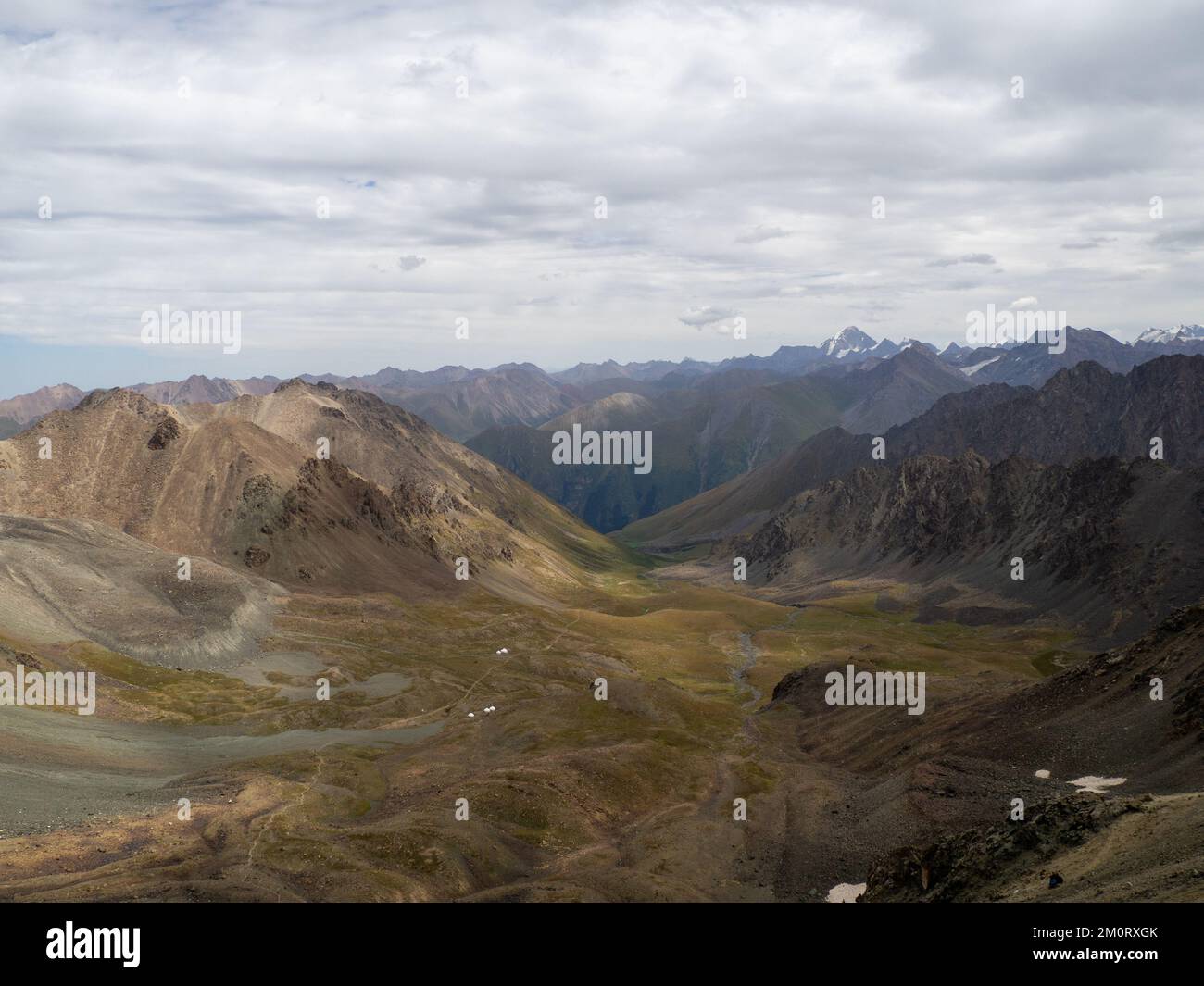 A natural landscape of hills under a cloudy sky Stock Photo - Alamy