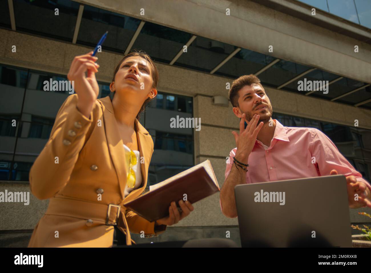 Two smart business people are thinking if they can realize their ...