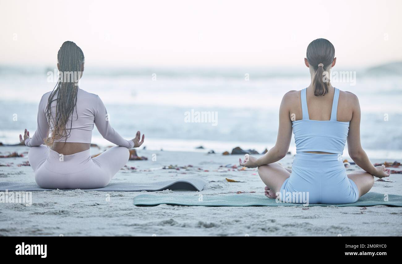 Beach, wellness and friends doing a yoga exercise for outdoor mind ...