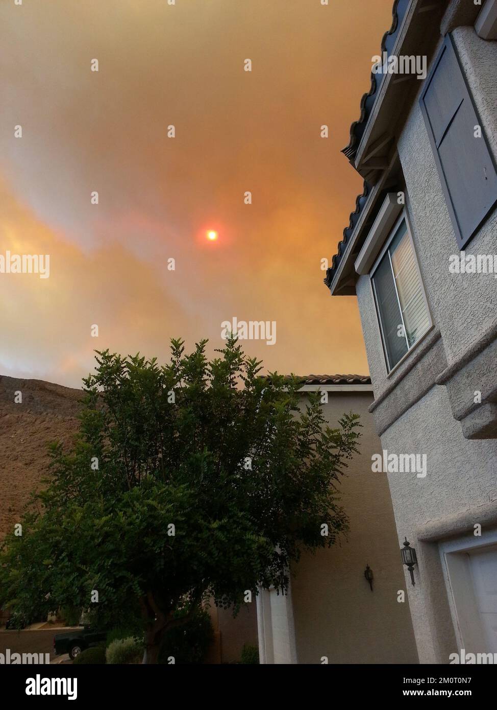 Sun behind smoke clouds from wildfires Stock Photo - Alamy