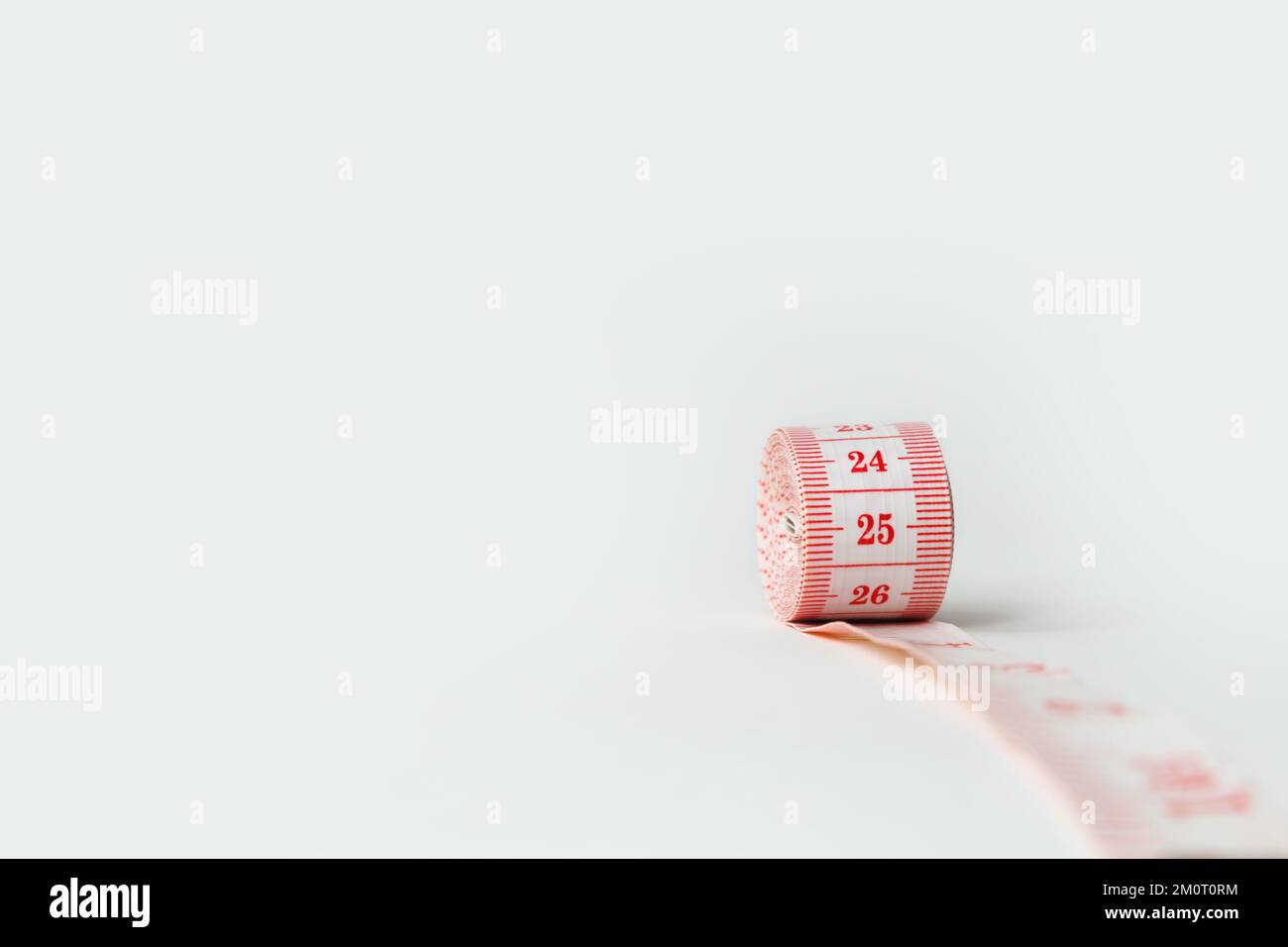 Tape Measure Rolled Isolated on White with Copyspace. 25 centimeters on ...