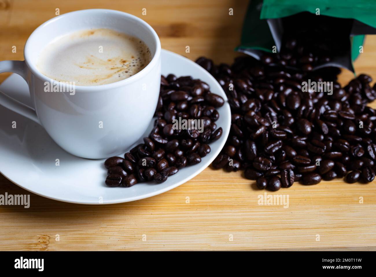 a cup of coffee with coffee beans, photographed from the front Stock ...