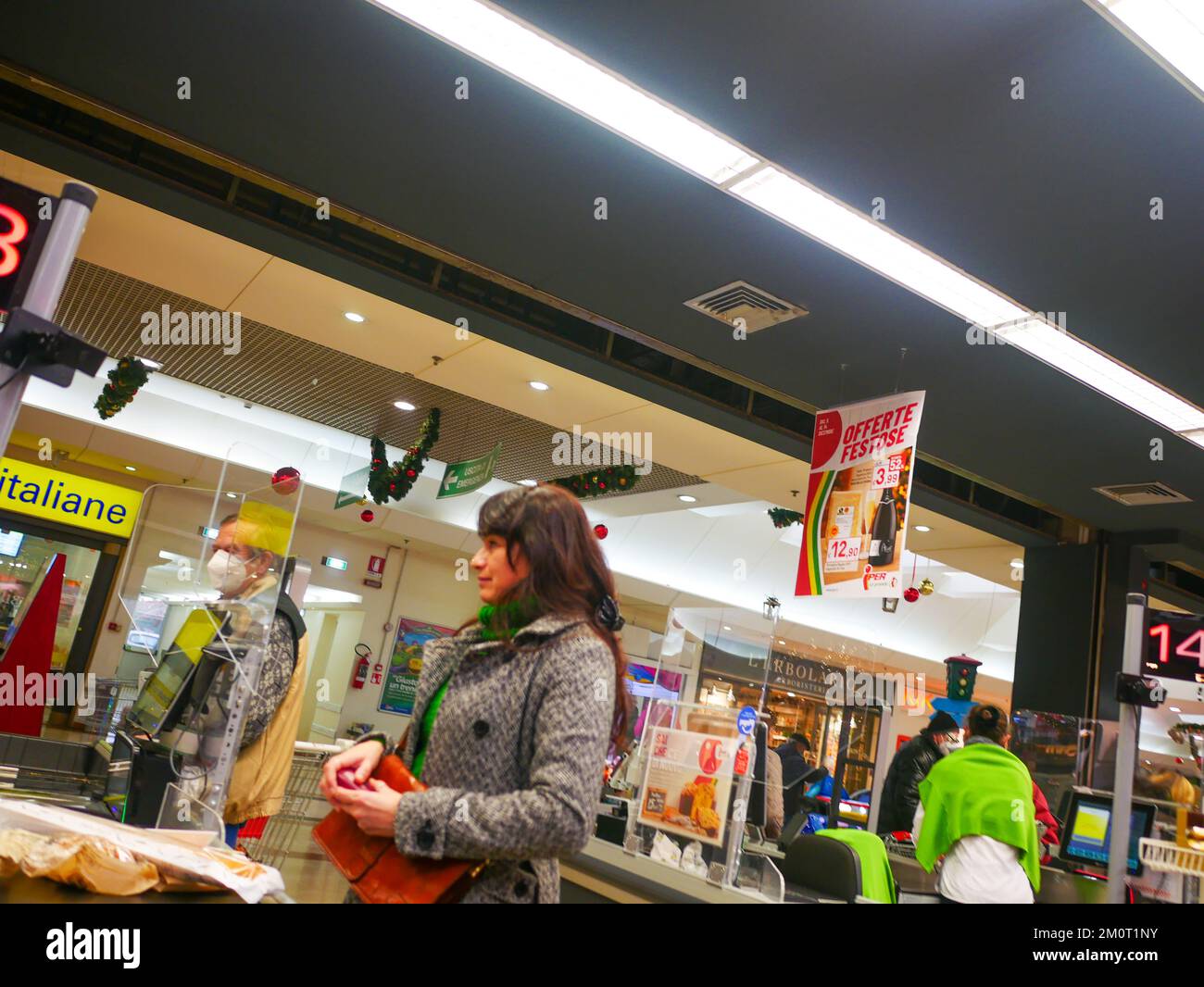 Cremona, Italy - December 2022 Latin hispanic woman at the cashier in ...