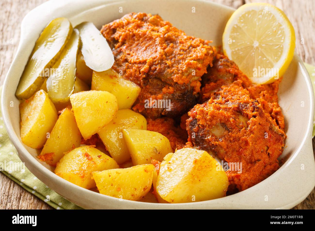 Macanese African Chicken Galinha a Africana close up on the pot on the ...