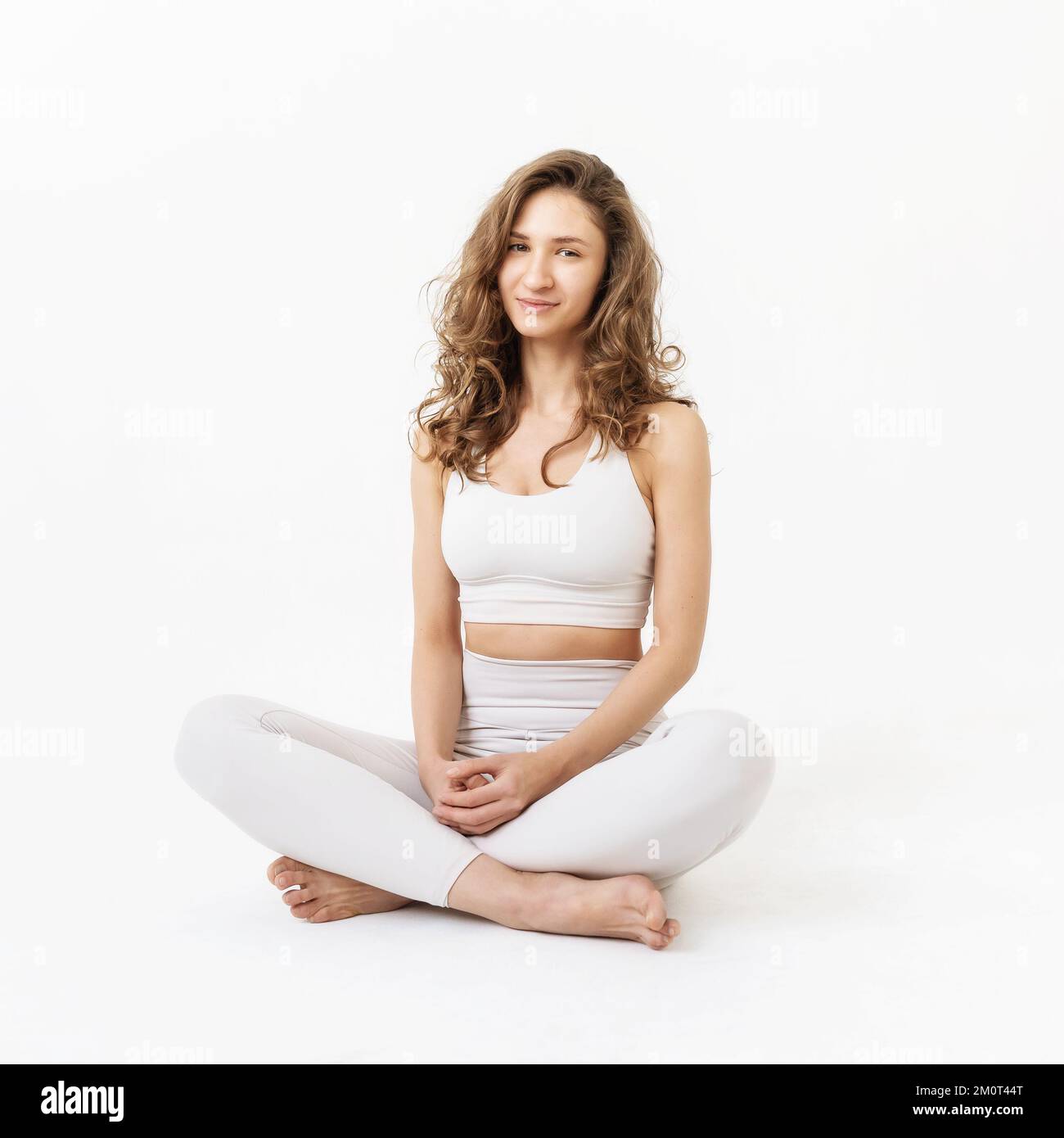 Portrait of a young girl smiling at the camera, leading a healthy ...