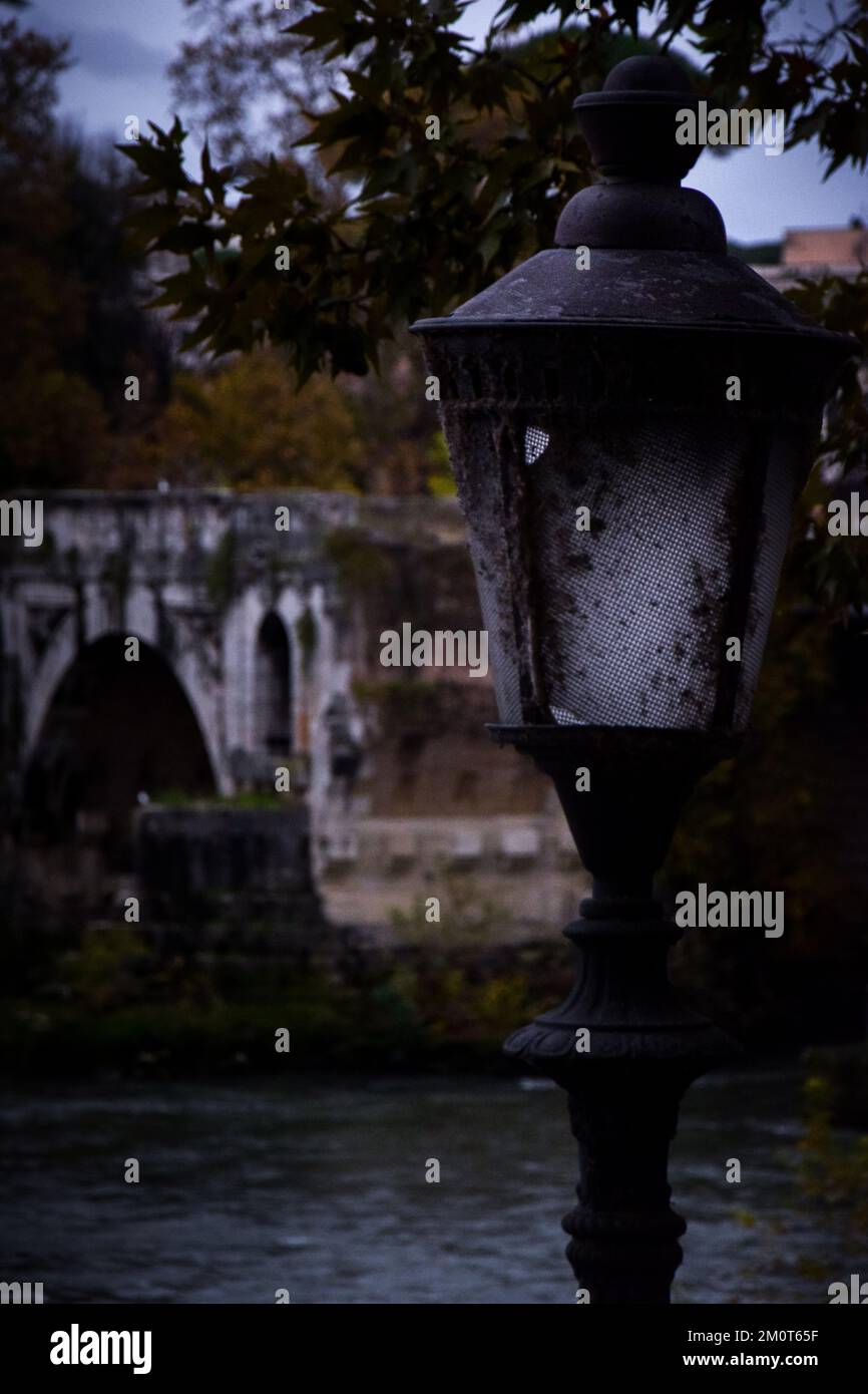 A close-up shot of a lantern with a blurred background of the river ...