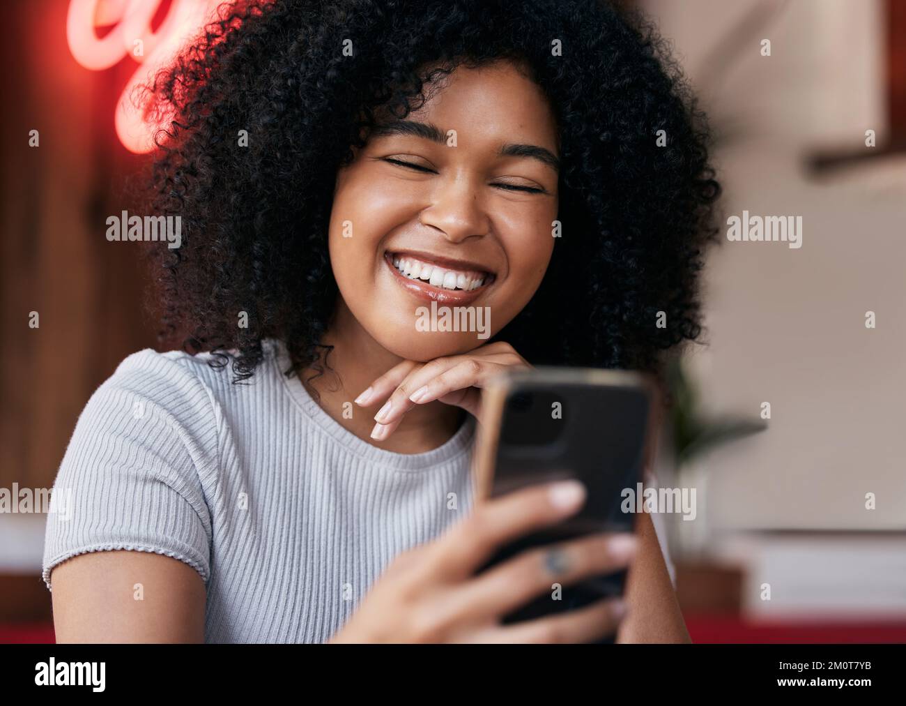Woman, cafe and phone or wifi search in a restaurant for social media ...