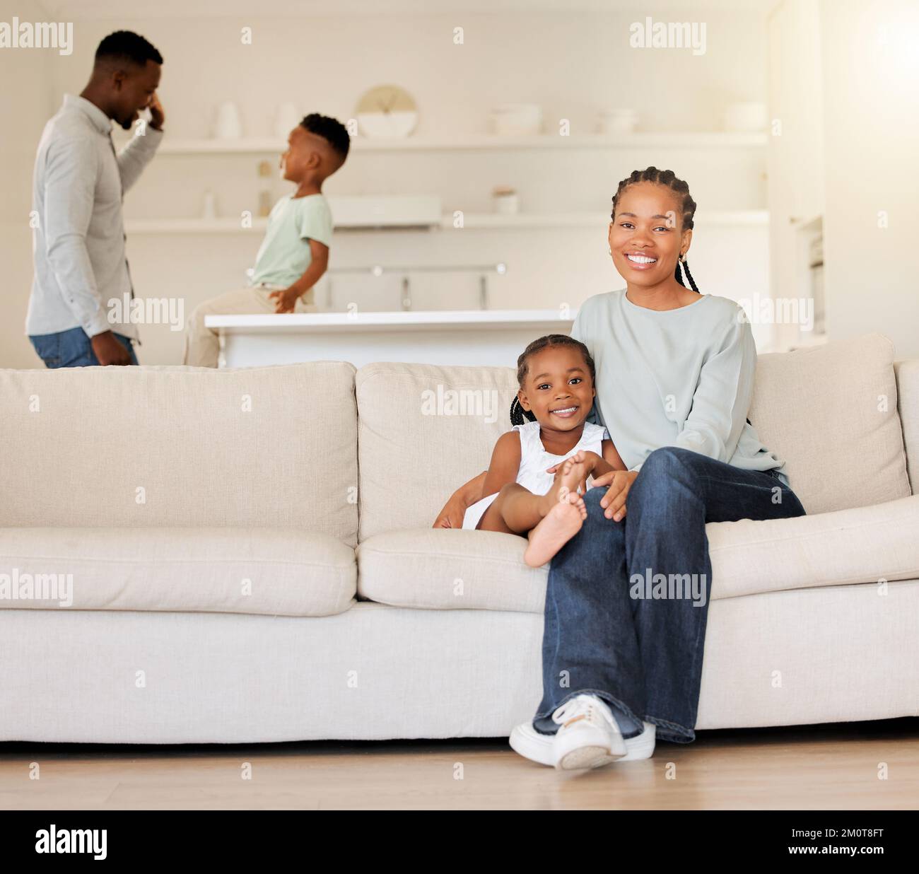 Happy and content young african american mother relaxing and bonding ...