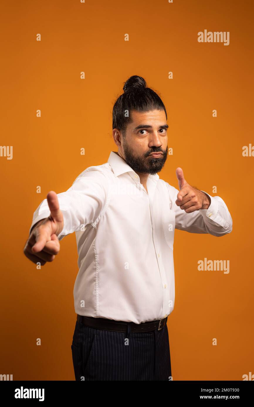 A beautiful shot of a Hispanic man showing emotions in front of an ...