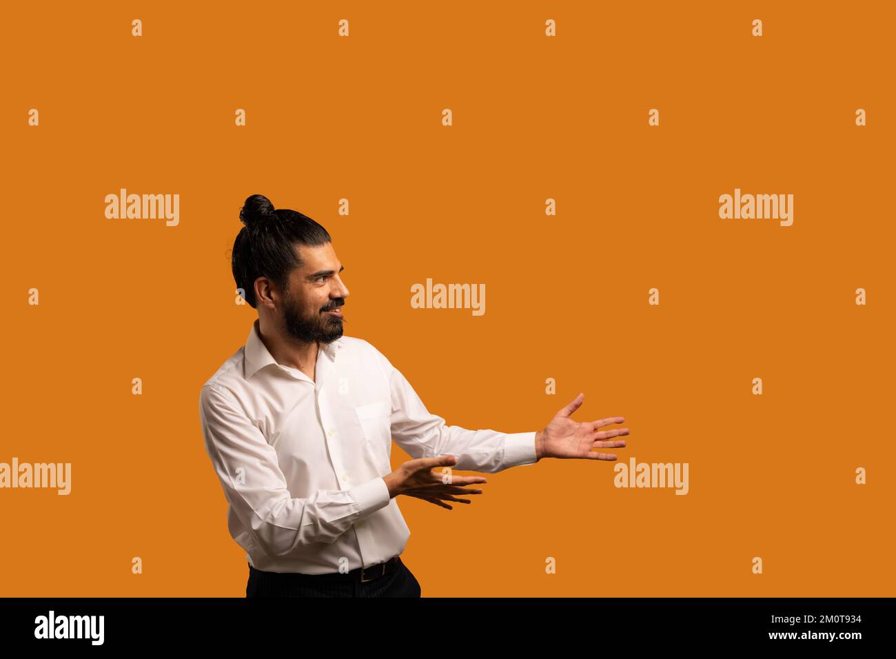 A beautiful shot of a Hispanic man showing emotions in front of an ...