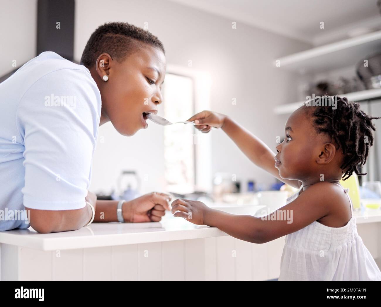 Breakfast is just as important for mommy. an adorable little girl ...