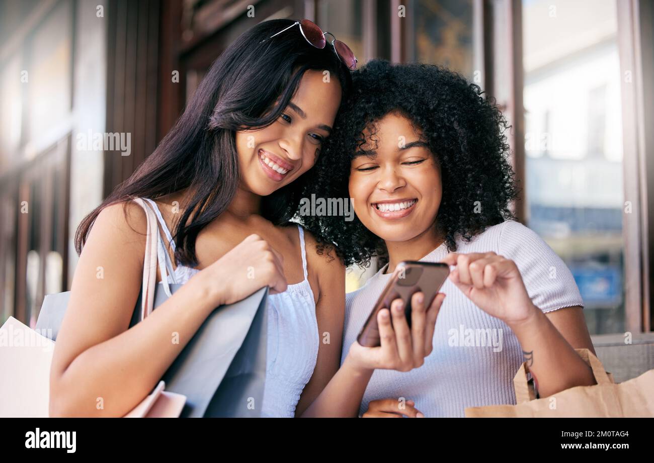 Women friends, shopping and phone in city for choice, e commerce ...
