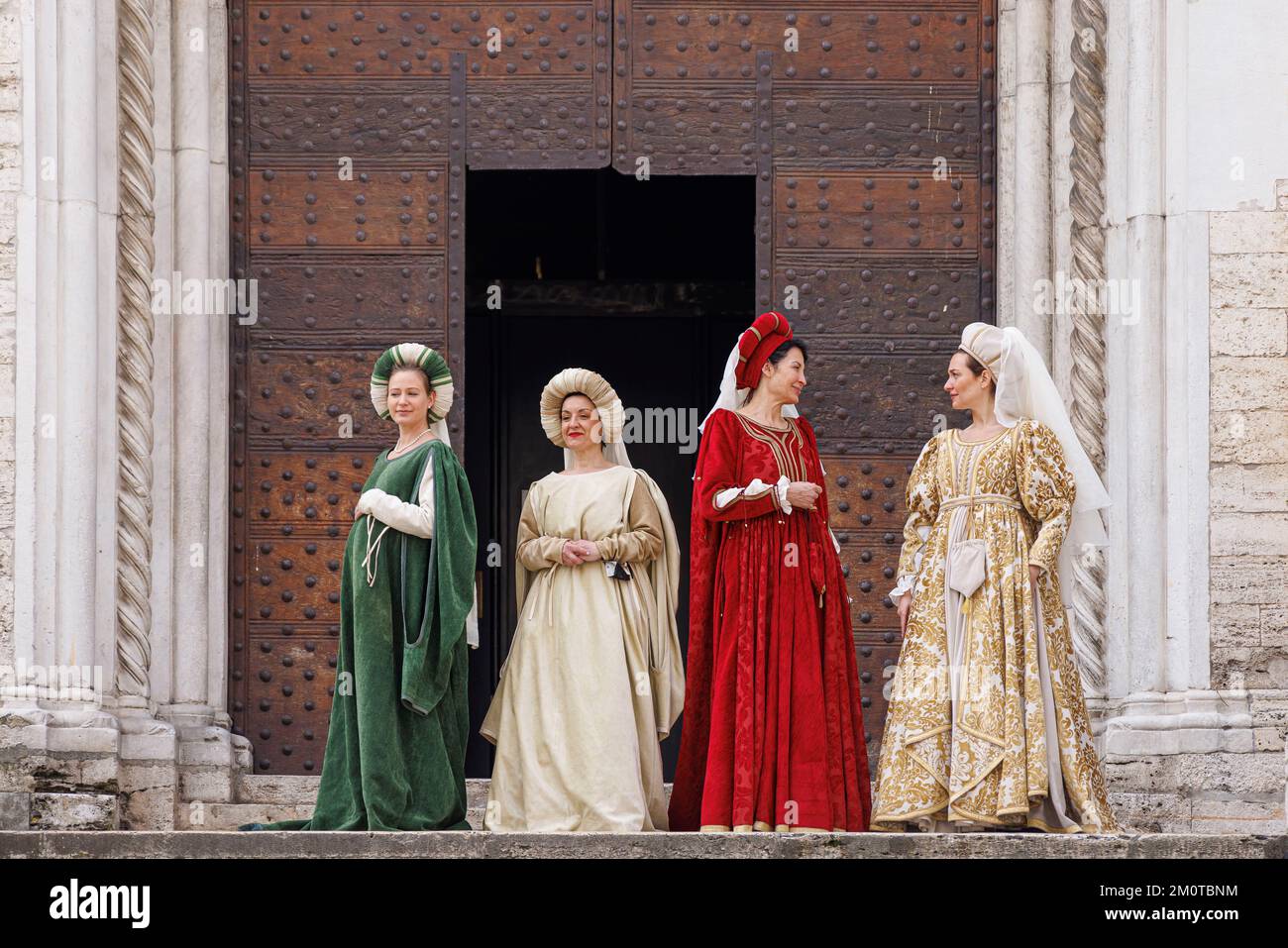 Italy, Umbria, Perugia, women in period costume in front of the dei ...