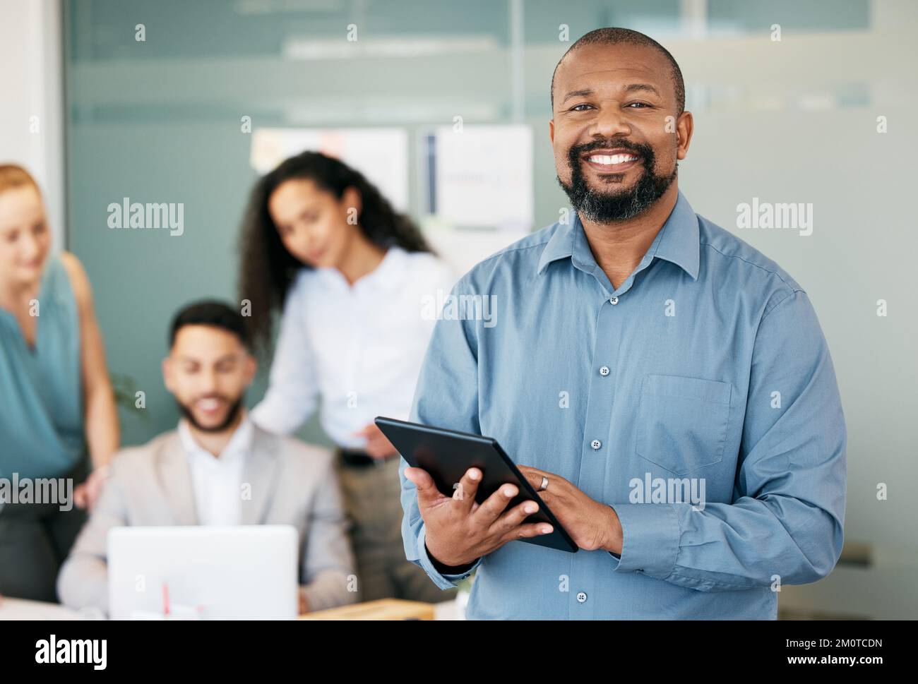 Shall I introduce you to the team. a mature businessman standing in the ...