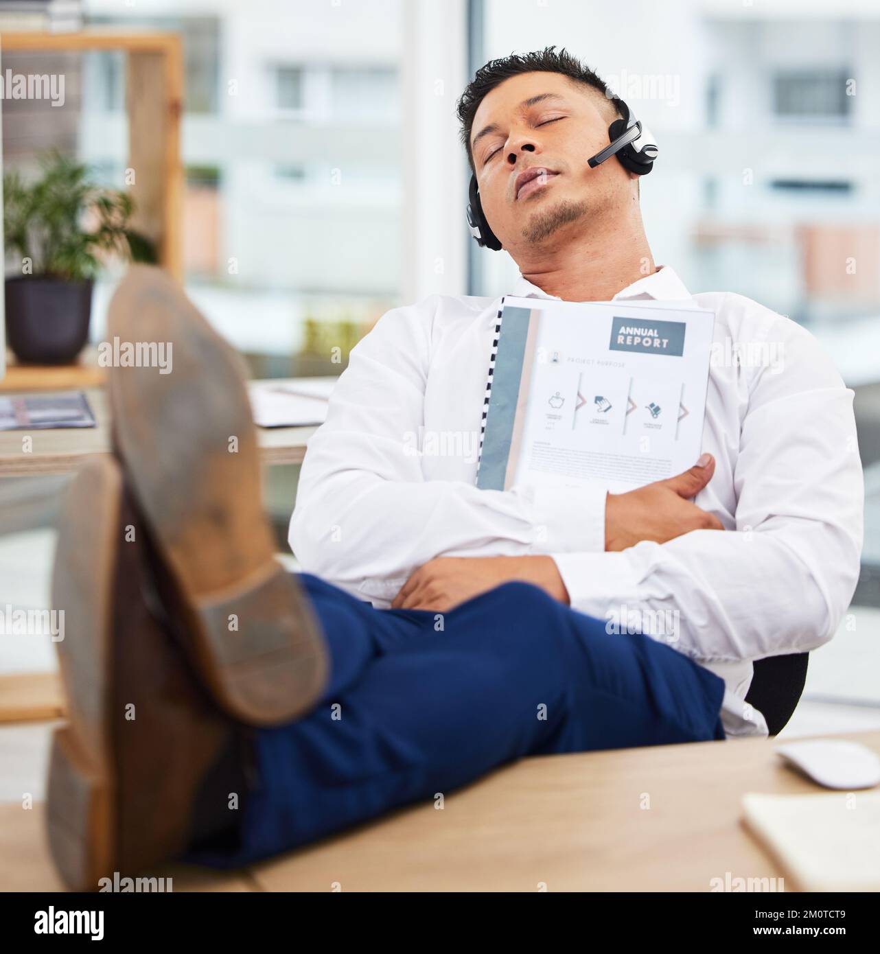 Sales man, sleeping and headset at office desk from reading annual ...