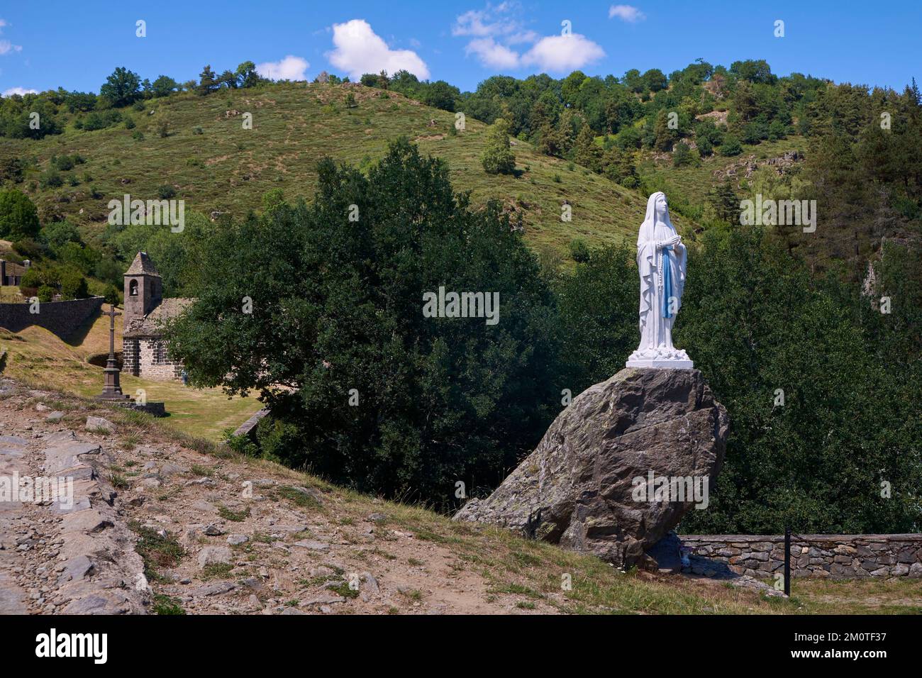 France, Cantal, Alleuze, Saint Illide church at the foot of La Barge ...