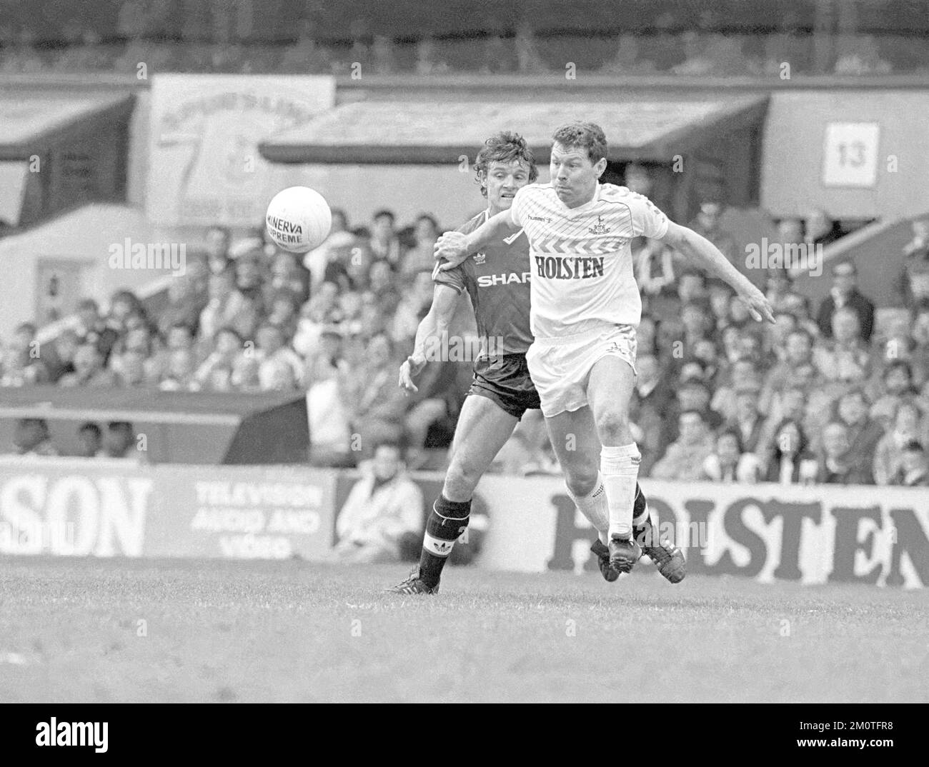Clive Allen, Spurs, holds of Paul Moran, Manchester United, in a race ...