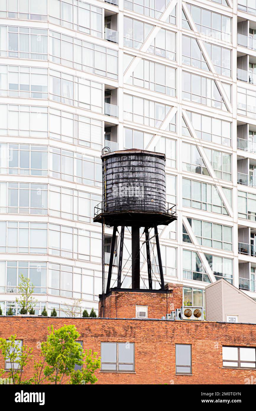 United States, Illinois, Chicago, wooden water tank on the roof of a ...
