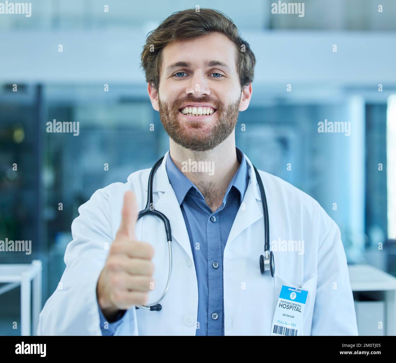 Portrait, doctor and thumbs up for success in hospital, clinic or healthcare facility. Thank you ...