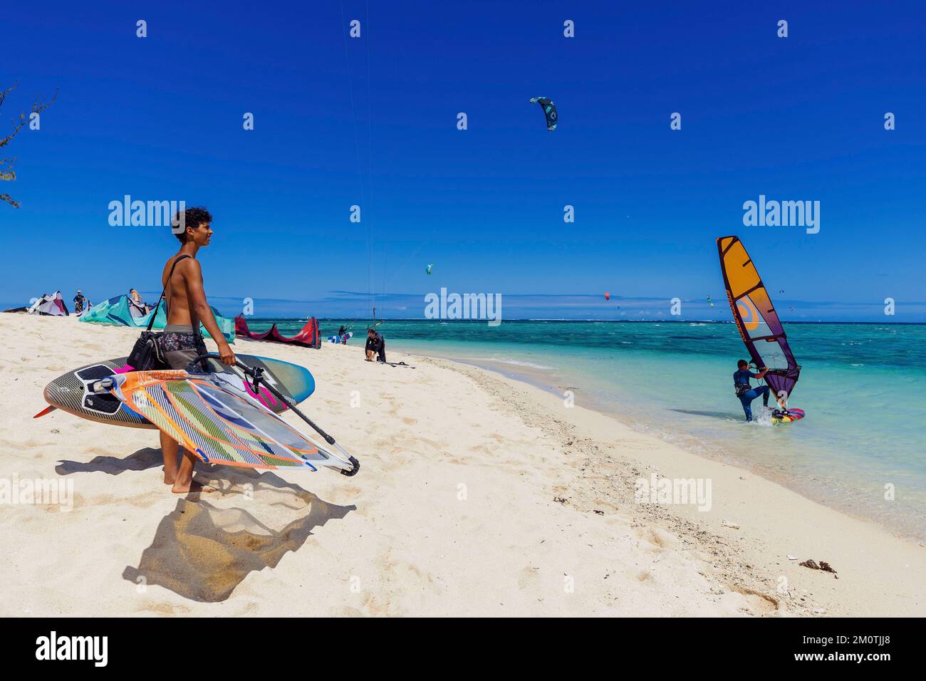 Mauritius, Black River district, man preparing to sail in a windsurf at ...