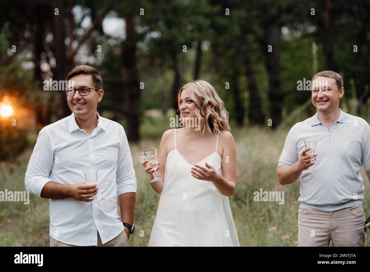 wedding congratulations of friends and guests with smiles and hugs of ...