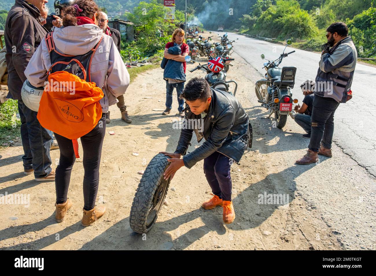 Nepal, Gandaki zone, repairing a puncture during the motorcycle raid ...