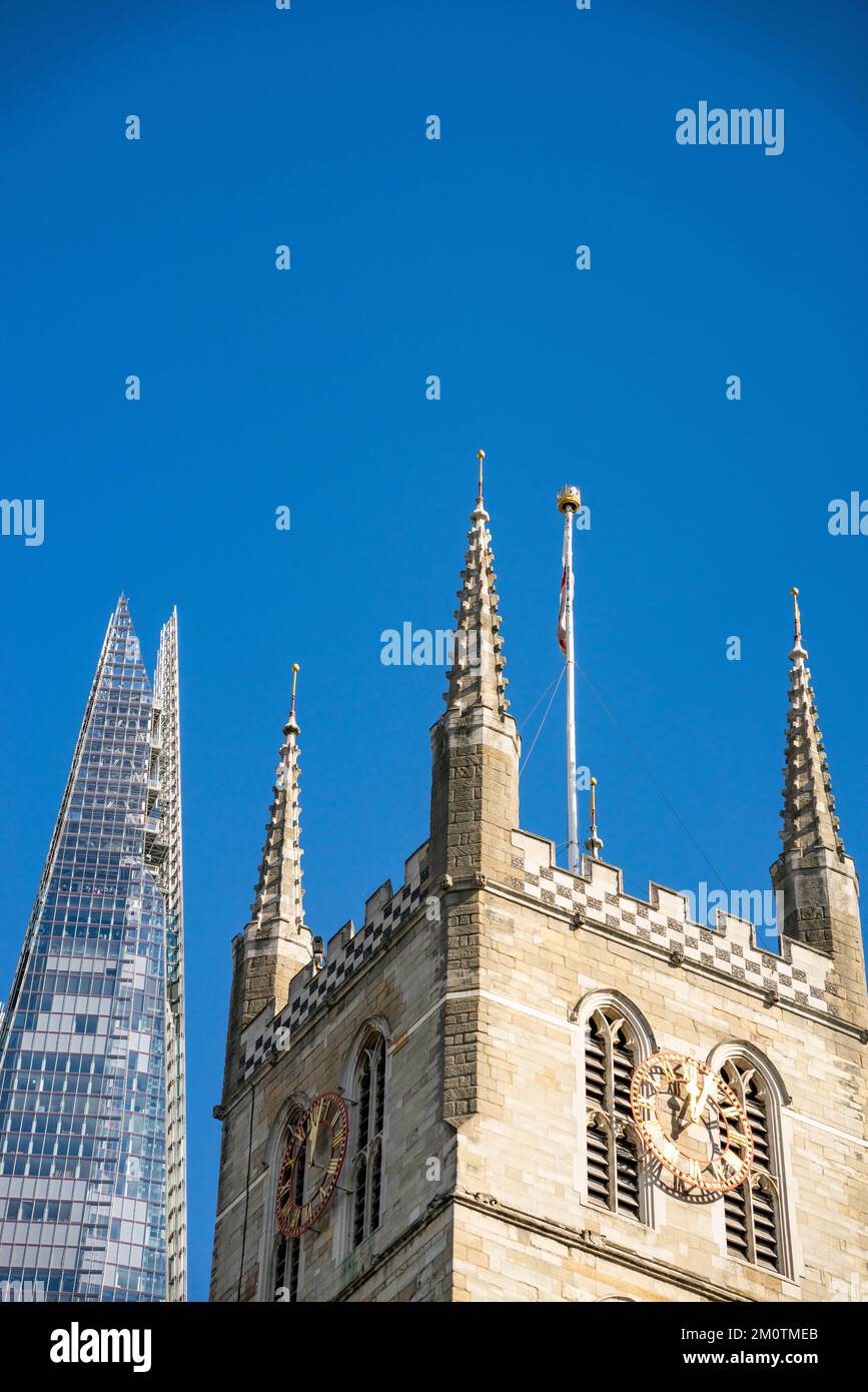 Street view in London of old buildings with the modern Shard building ...