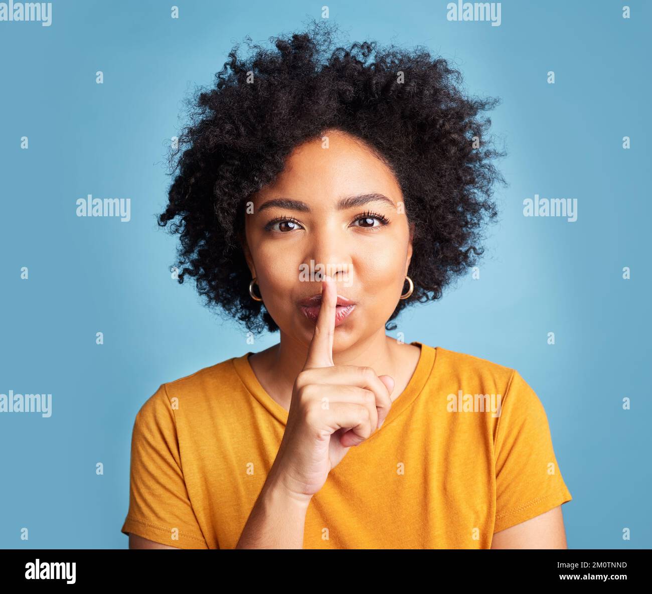 Ive got a secret for you. an attractive young woman standing alone ...