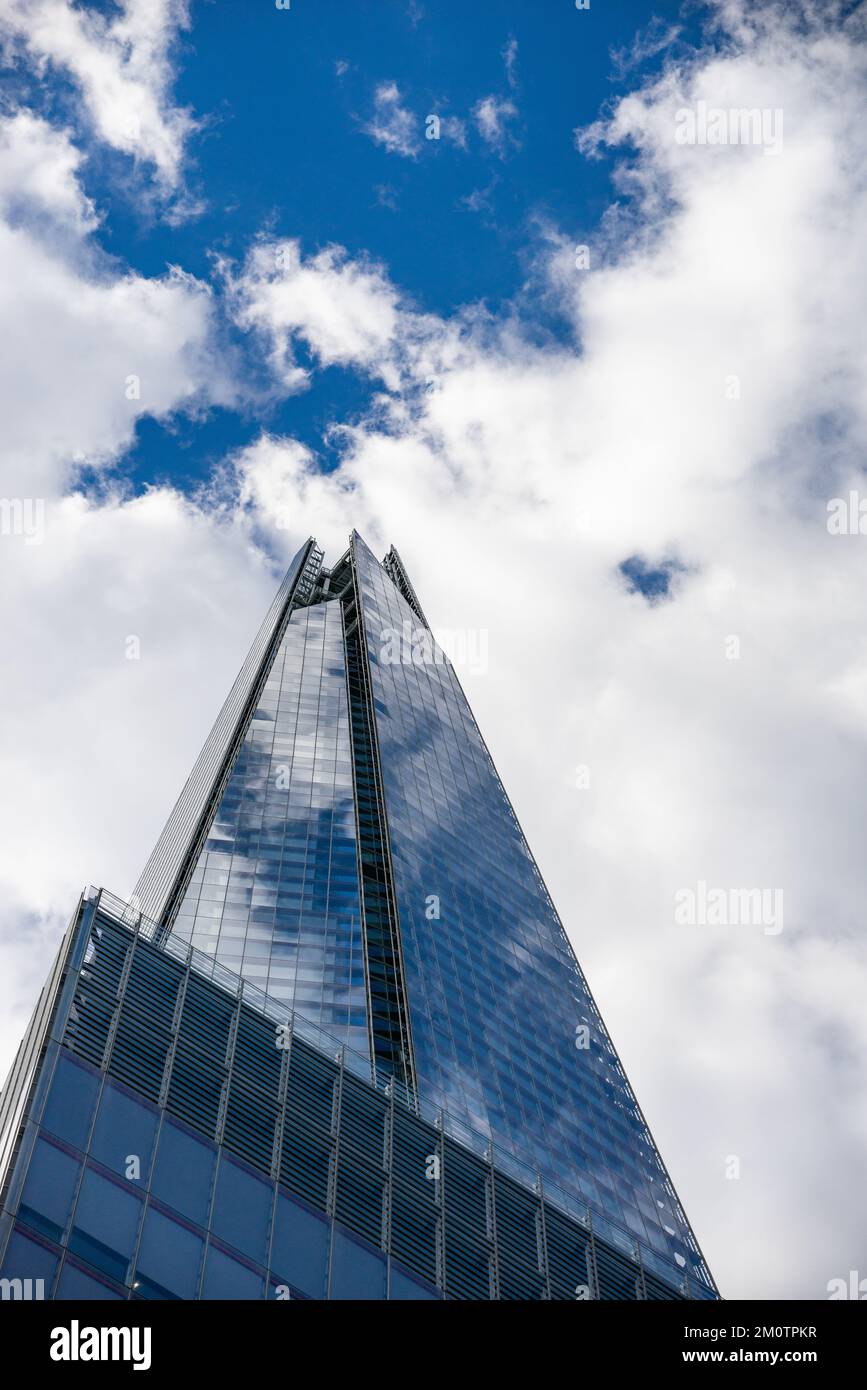 Street view in London of old buildings with the modern Shard building ...