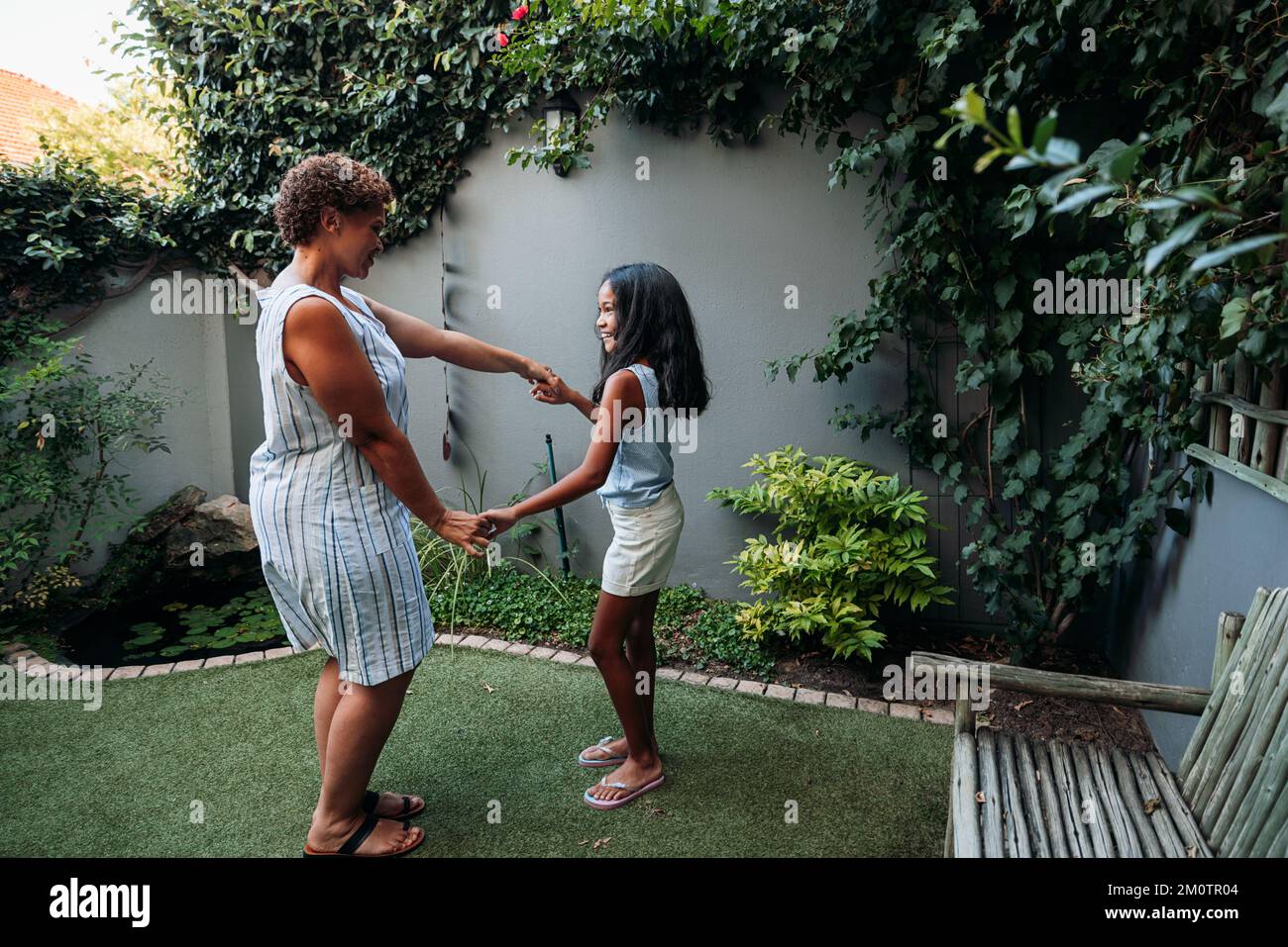 Granny granddaughter dancing together hi-res stock photography and ...