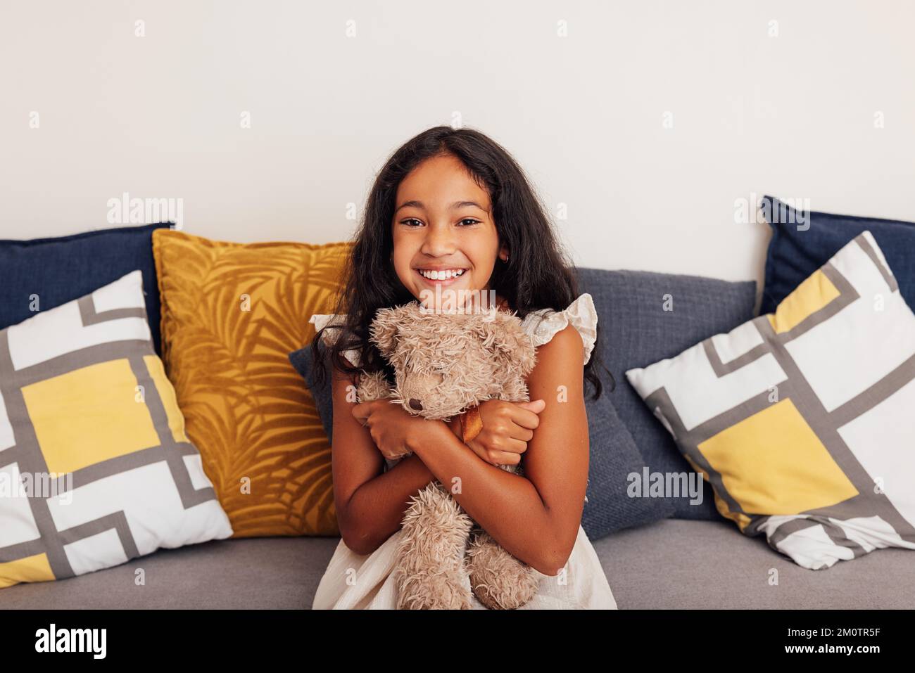 Girl hugging teddy bear hi-res stock photography and images - Alamy