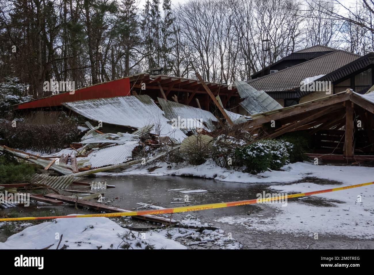 Collapsed roof of an old wooden building. Abandoned architecture, ruins ...