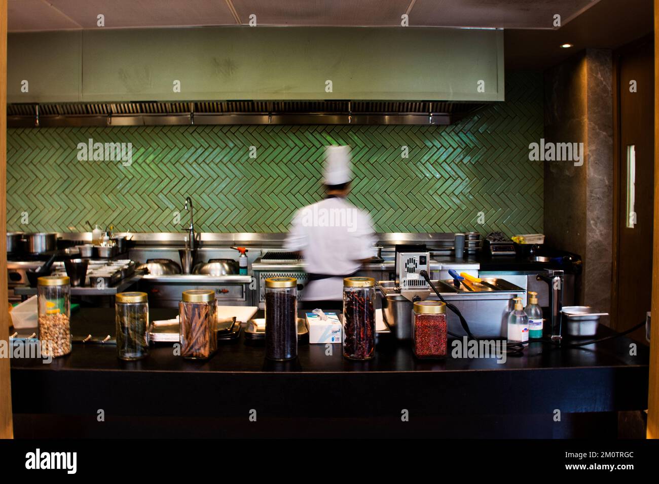 Thai chef cooking food fusion and cuisine modern style in luxury open ...