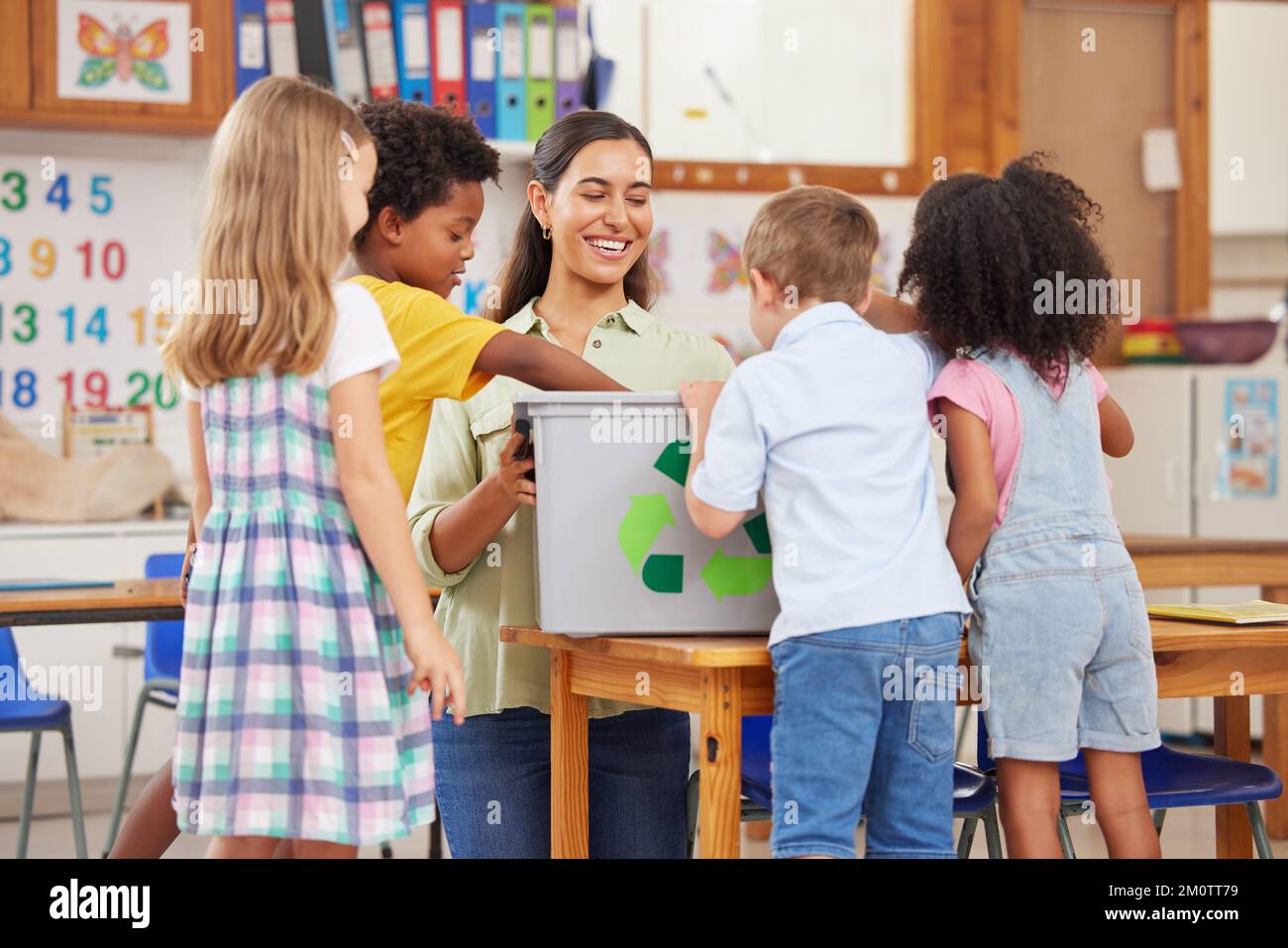 Theyre excited to learn. a young woman teaching preschool children ...