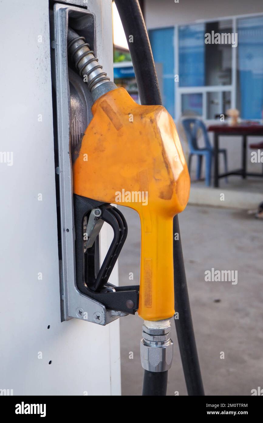 Orange and black oil nozzle Stock Photo - Alamy